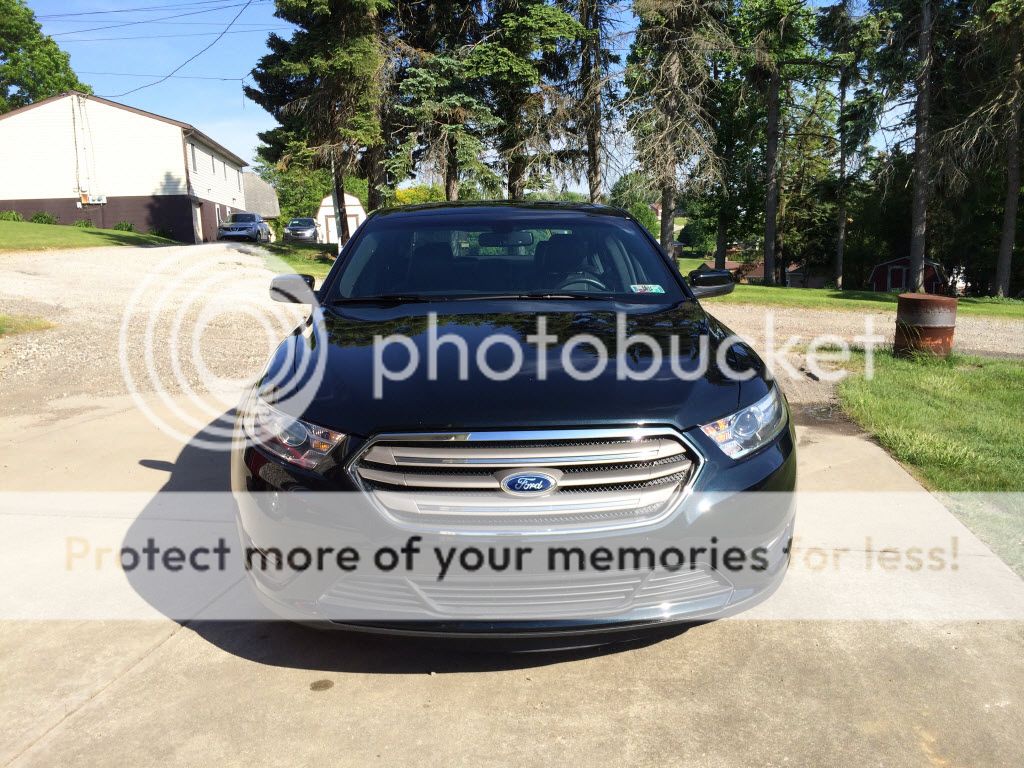 Removal of front license plate holder. - Ford Taurus Forum